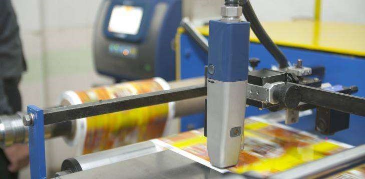 Domino CIJ Ax150i printing on food packaging at Goldiee